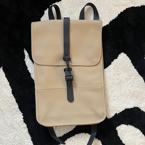 Rains | Bags | Rains Tan Backpack With Black Accents | Poshmark